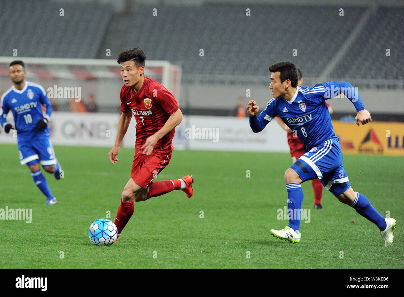 Wu Lei of China's Shanghai SIPG, left, challenges Cho Won-hee of South ...