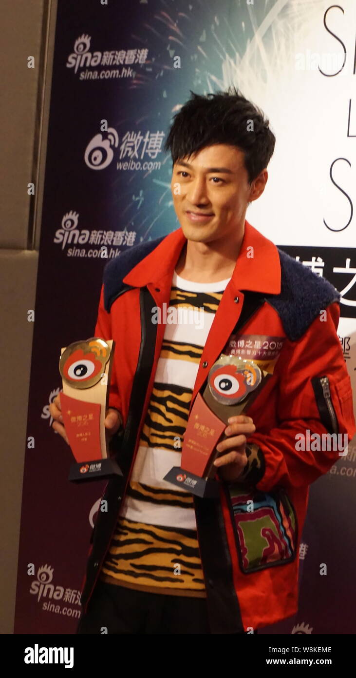 Hong Kong singer and actor Raymond Lam poses with his trophies during ...