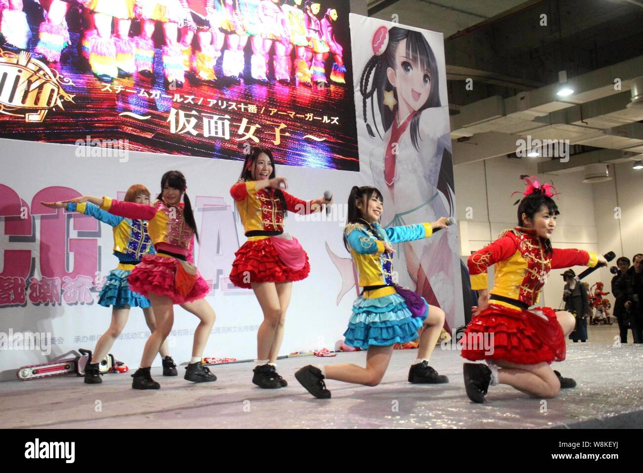 Members of Japanese idol girl group Kamen Joshi, literally "Masked Girls", perform during the ...