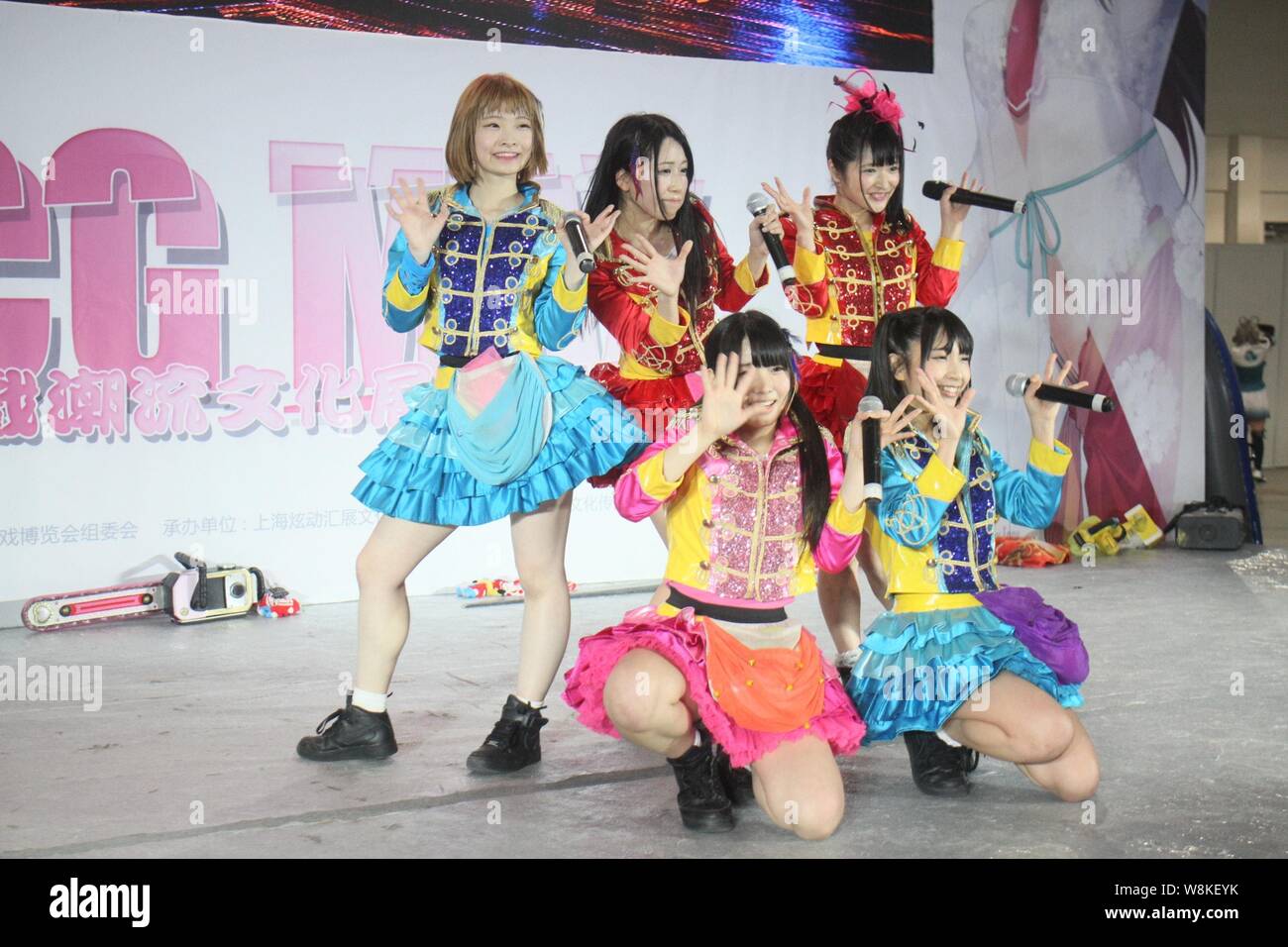 Members of Japanese idol girl group Kamen Joshi, literally "Masked Girls", perform during the ...