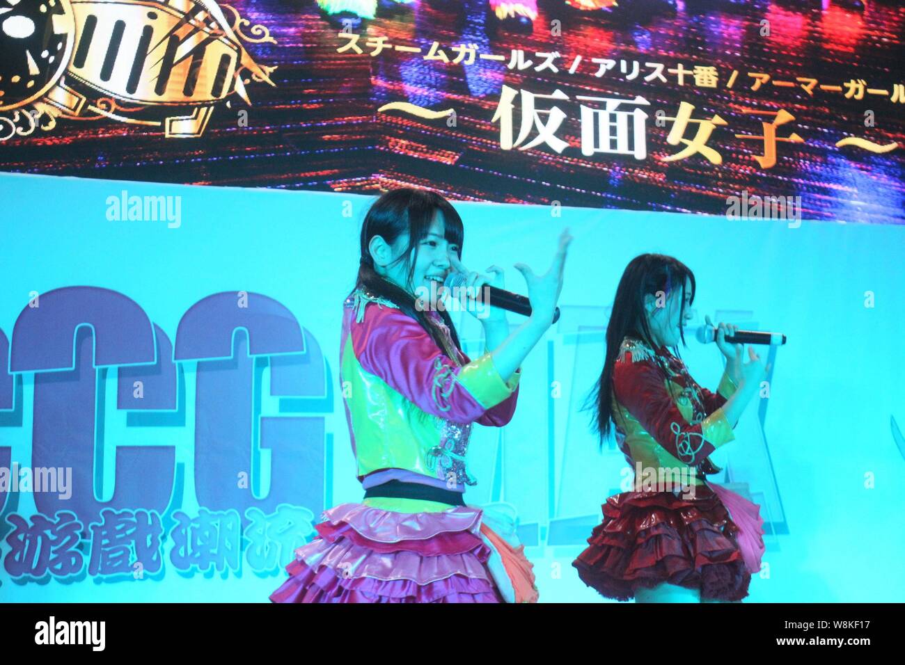 Members of Japanese idol girl group Kamen Joshi, literally "Masked Girls", perform during the ...