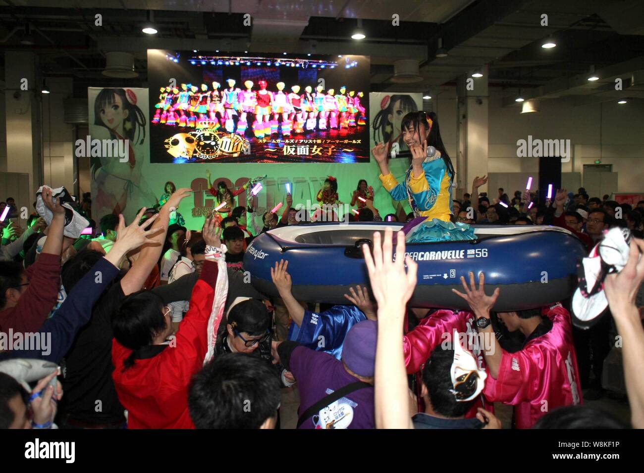 Members of Japanese idol girl group Kamen Joshi, literally "Masked Girls", perform during the ...