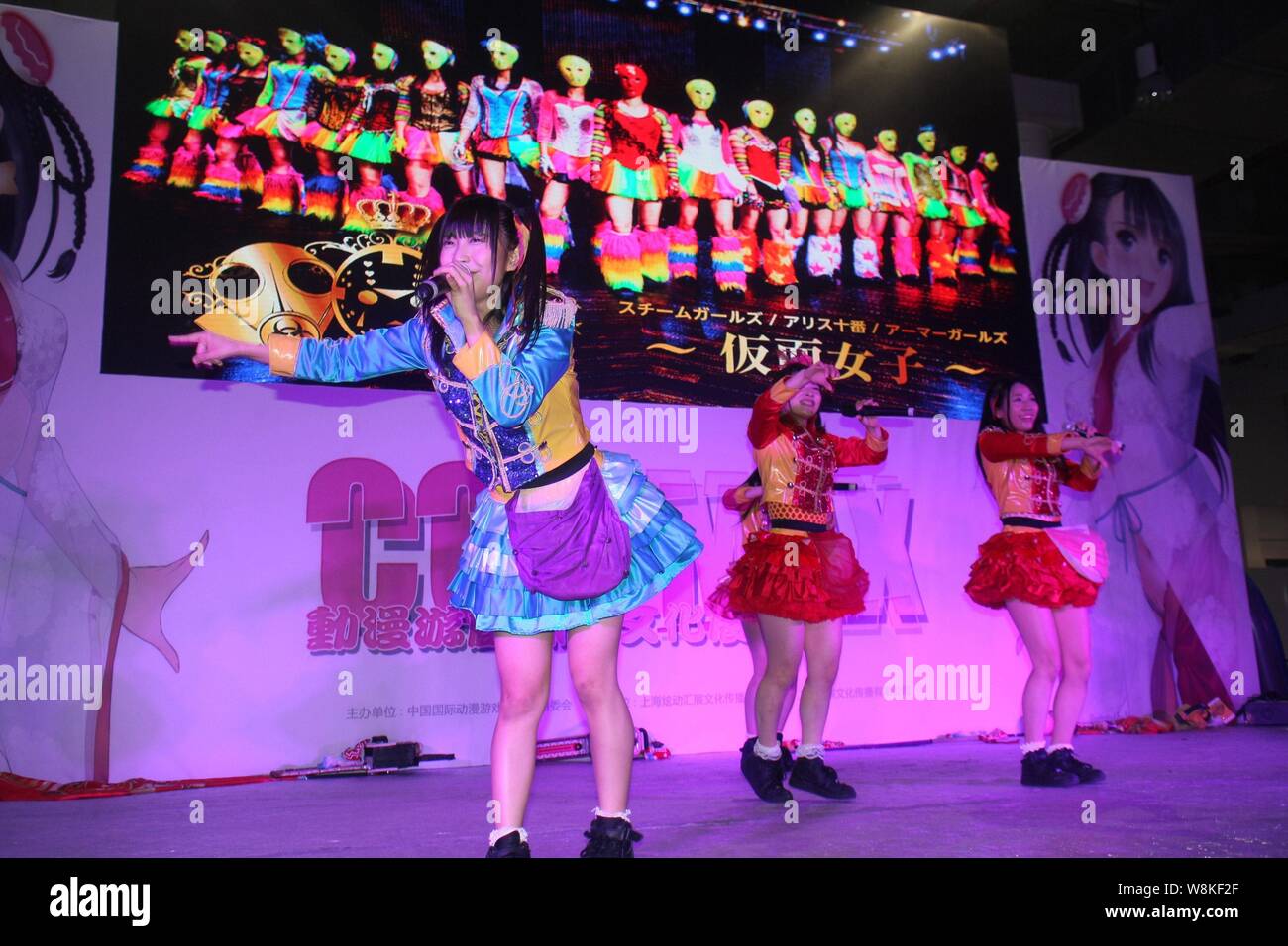 Members of Japanese idol girl group Kamen Joshi, literally "Masked Girls", perform during the ...