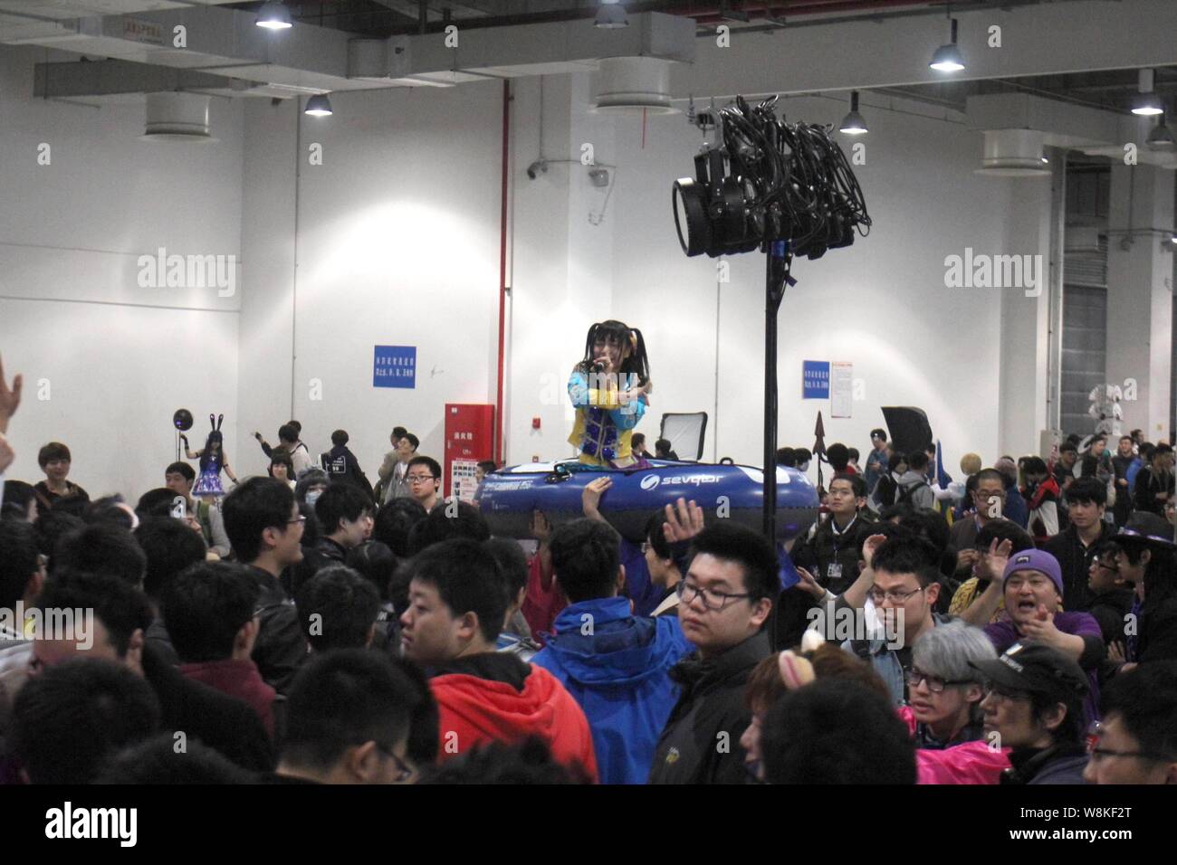 A member of Japanese idol girl group Kamen Joshi, literally "Masked Girls", performs during the ...