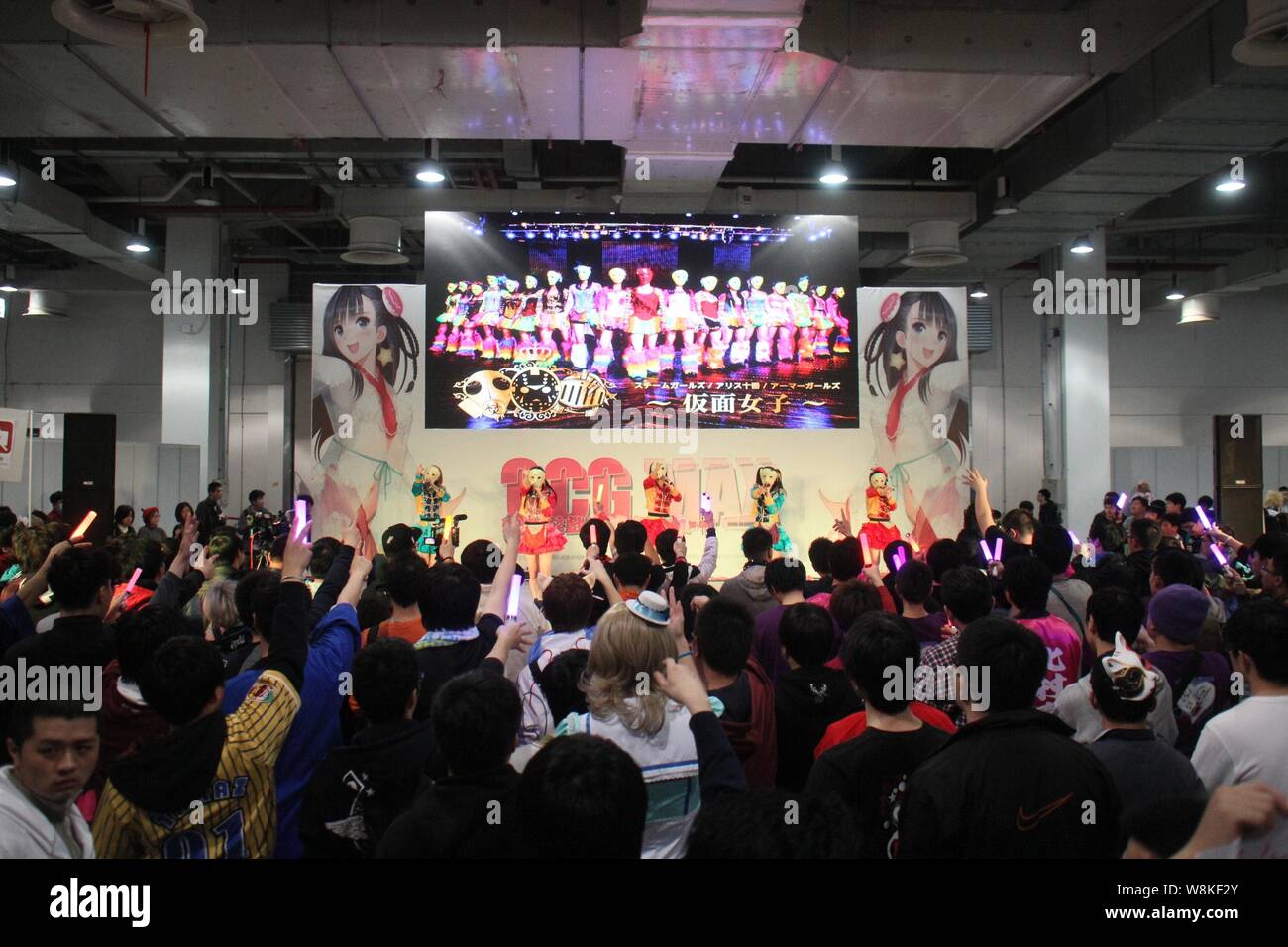 Members of Japanese idol girl group Kamen Joshi, literally "Masked Girls", perform during the ...