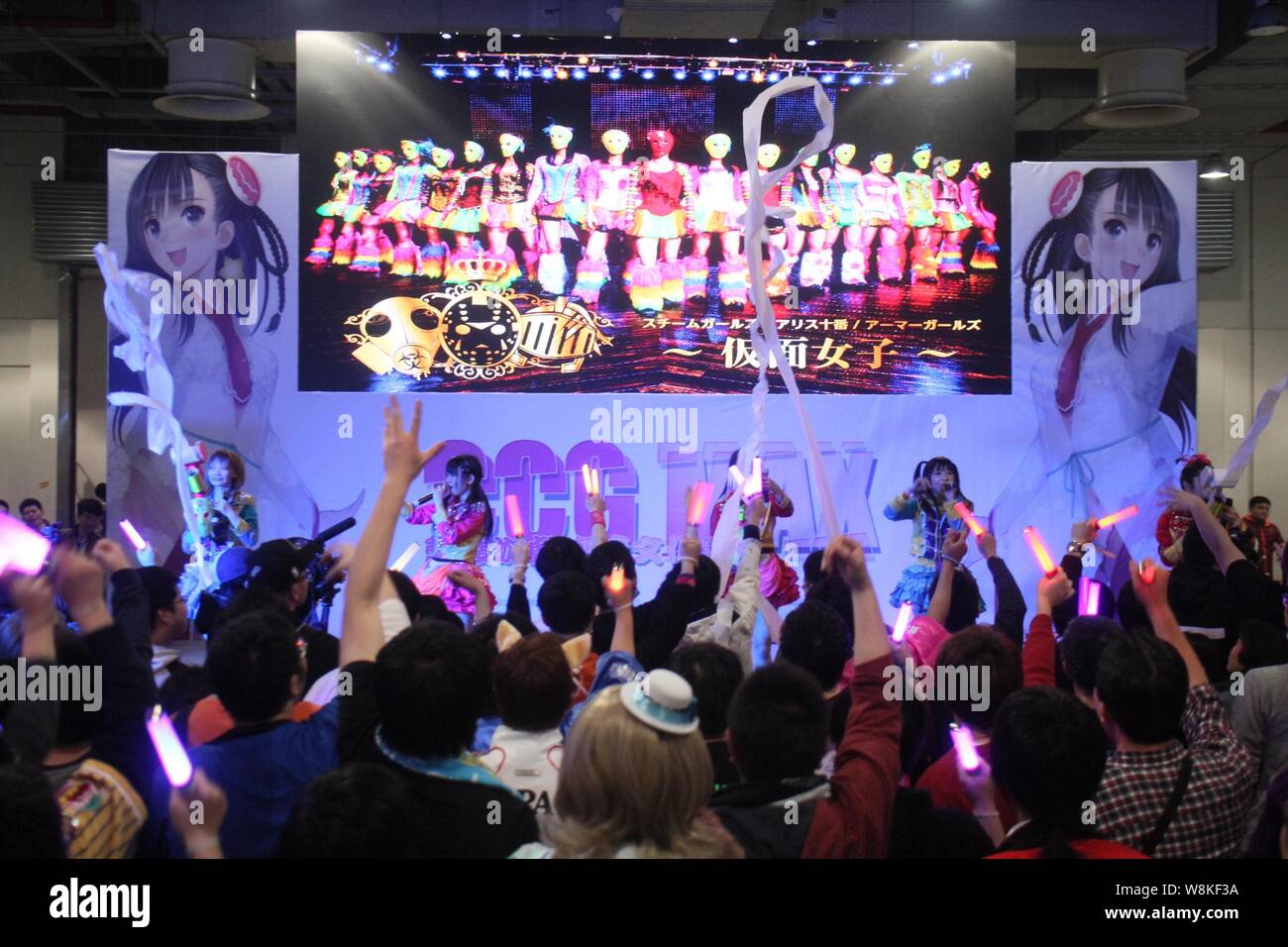 Members of Japanese idol girl group Kamen Joshi, literally "Masked Girls", perform during the ...