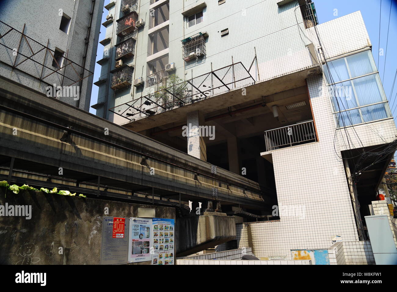 View of the monorails of Chongqing Light rail Line 2 through a building ...