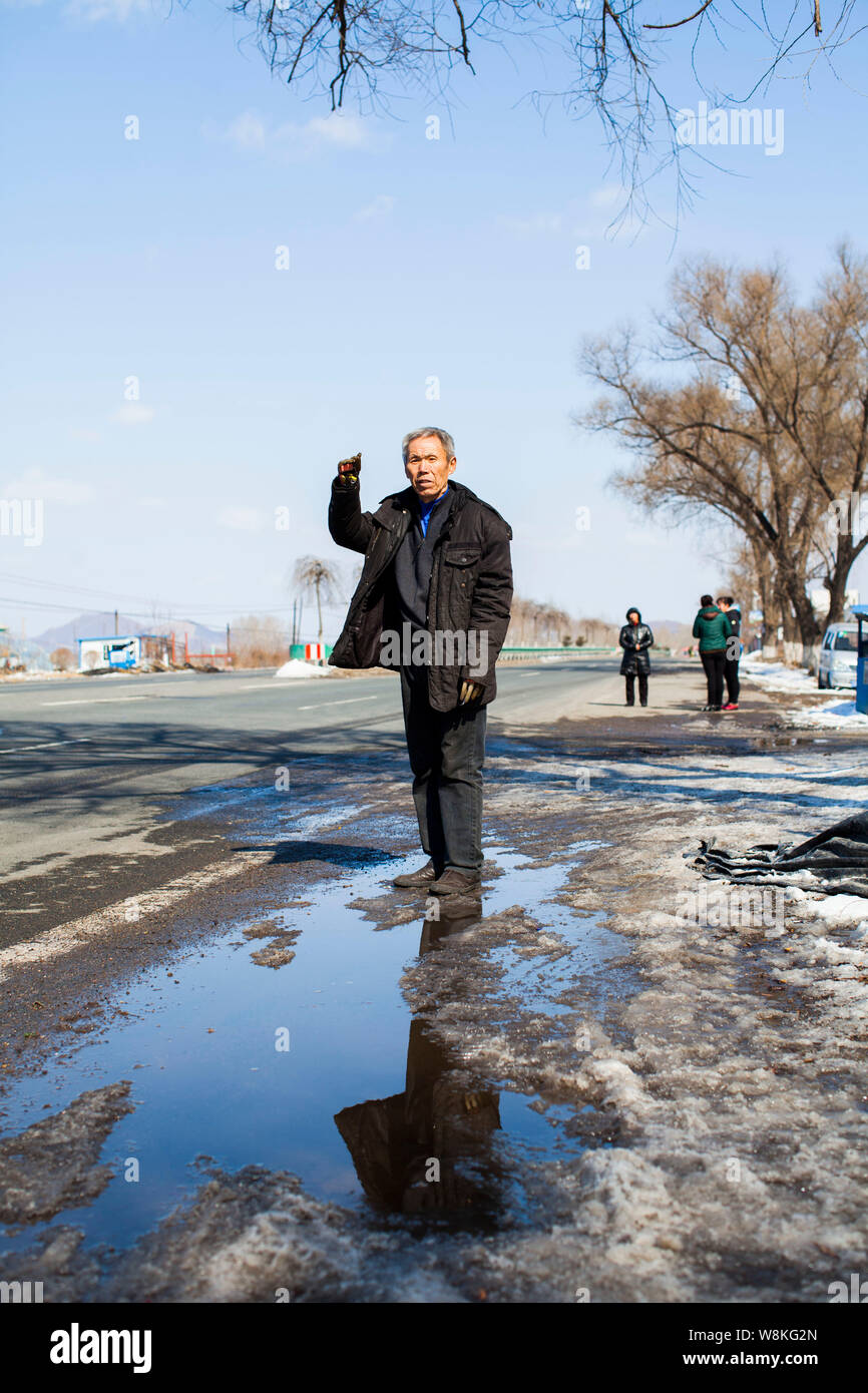63-year-old armless farmer Sun Jifa who is equipped with his homemade ...