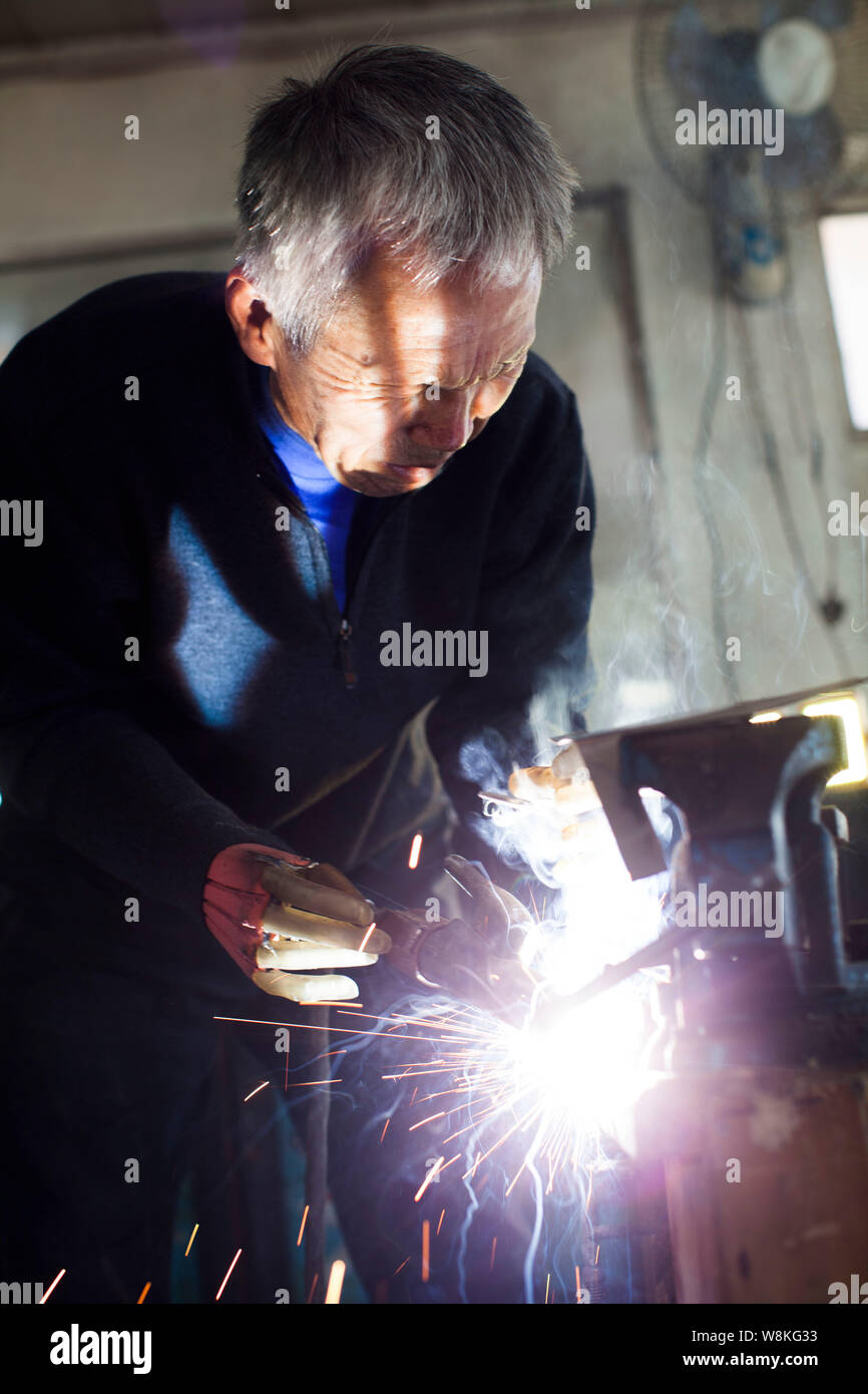 63-year-old armless farmer Sun Jifa who is equipped with his homemade ...