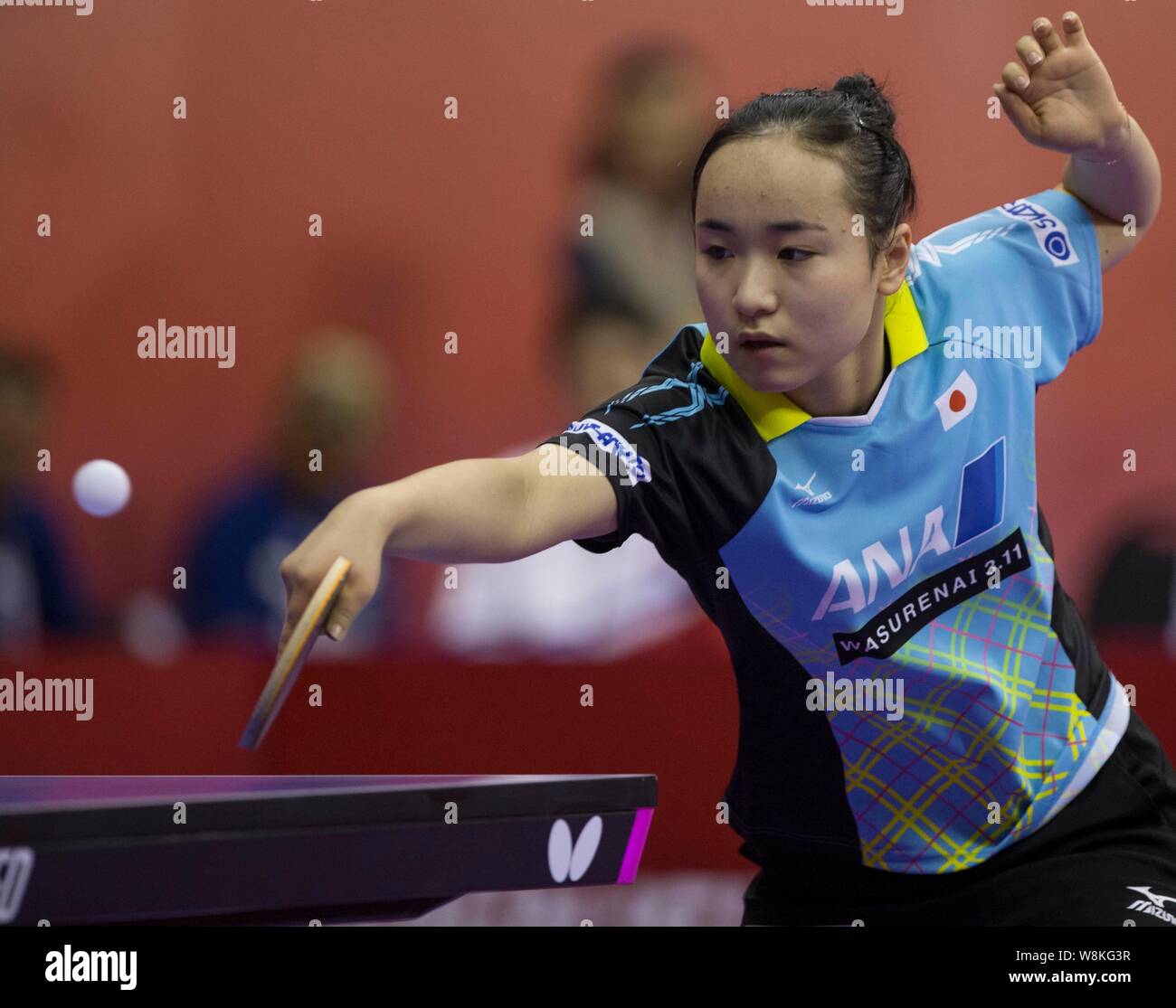 Mima Ito of Japan returns a shot to Kim Song I of North Korea during ...