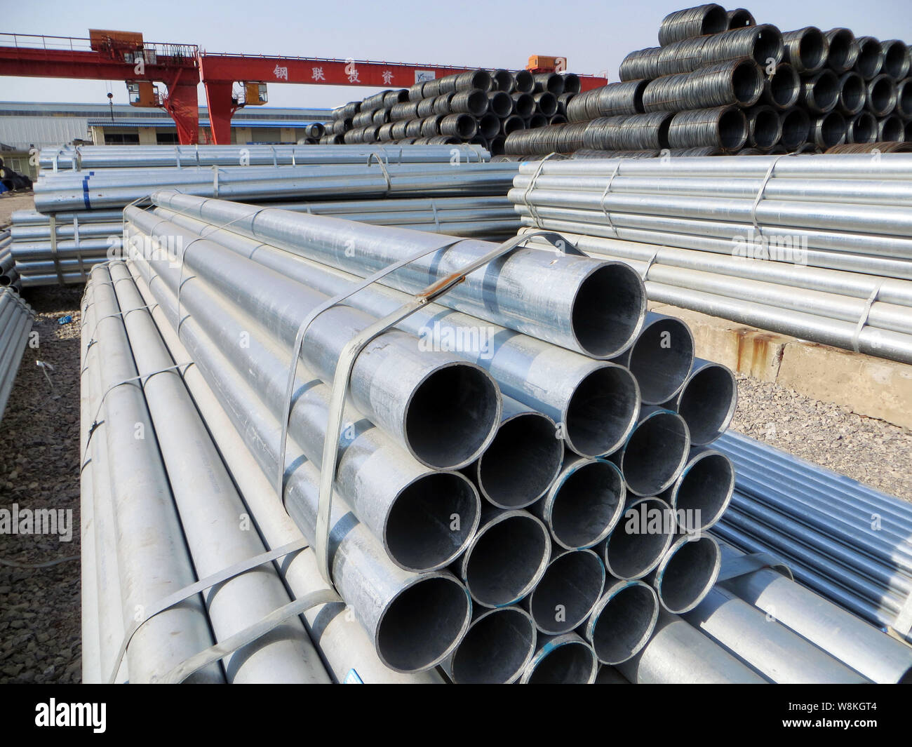 --FILE--Stacks of steel tubes and coiled steel rods are pictured at a ...
