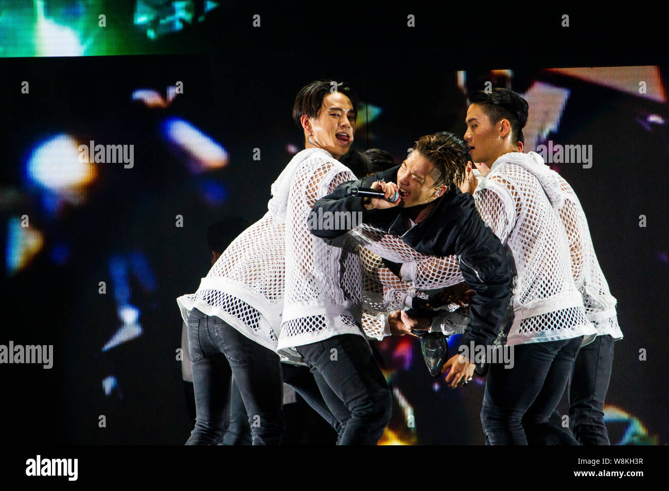 A member of South Korean boy band BigBang or Big Bang, center, performs during the Bigbang 2016 ...