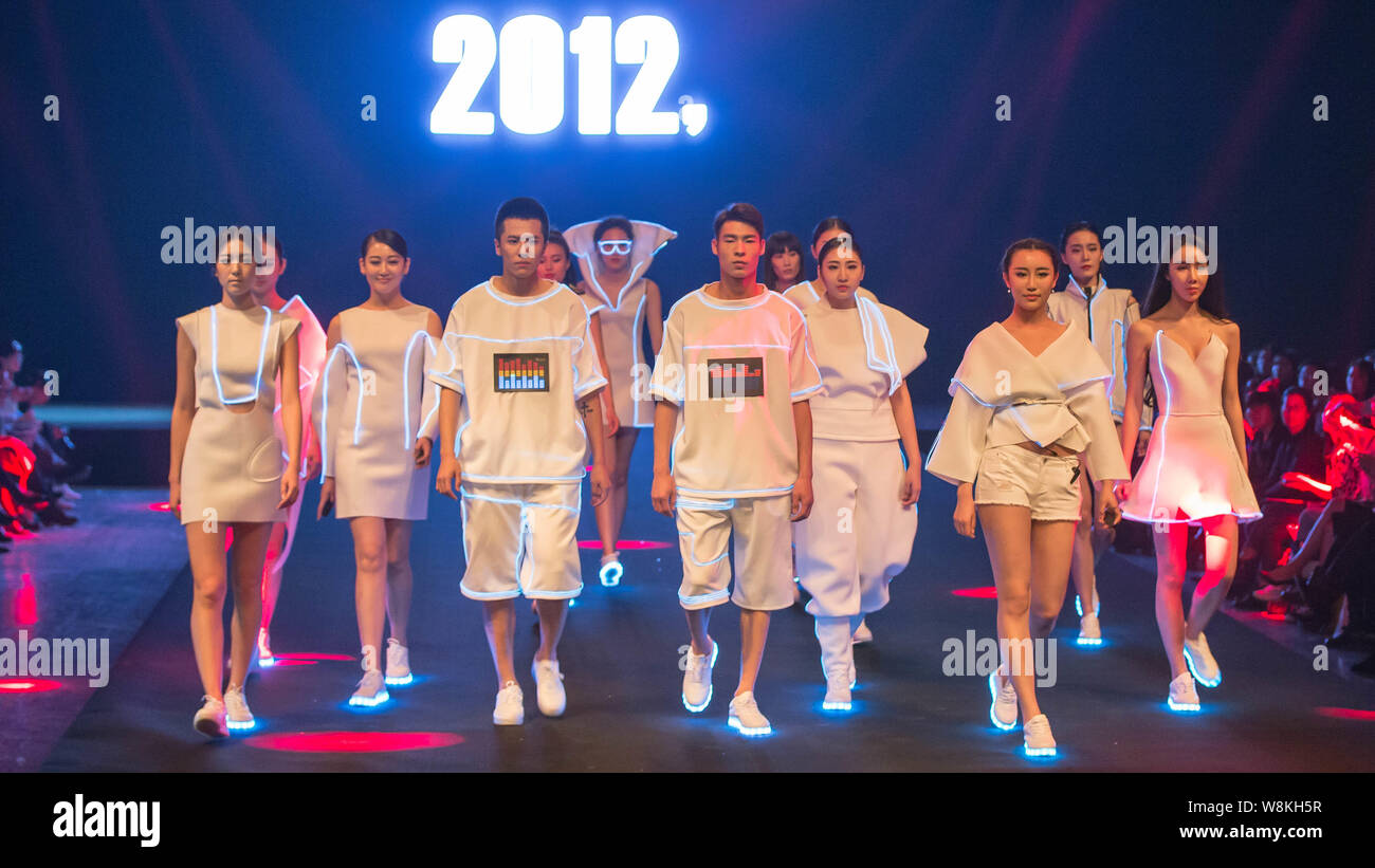 Models display new creations during a fashion show released by senior ...