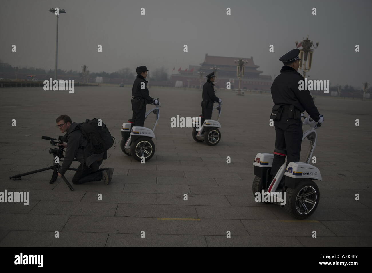 Chinese police officers drive Segway-like two-wheeled electric vehicles ...