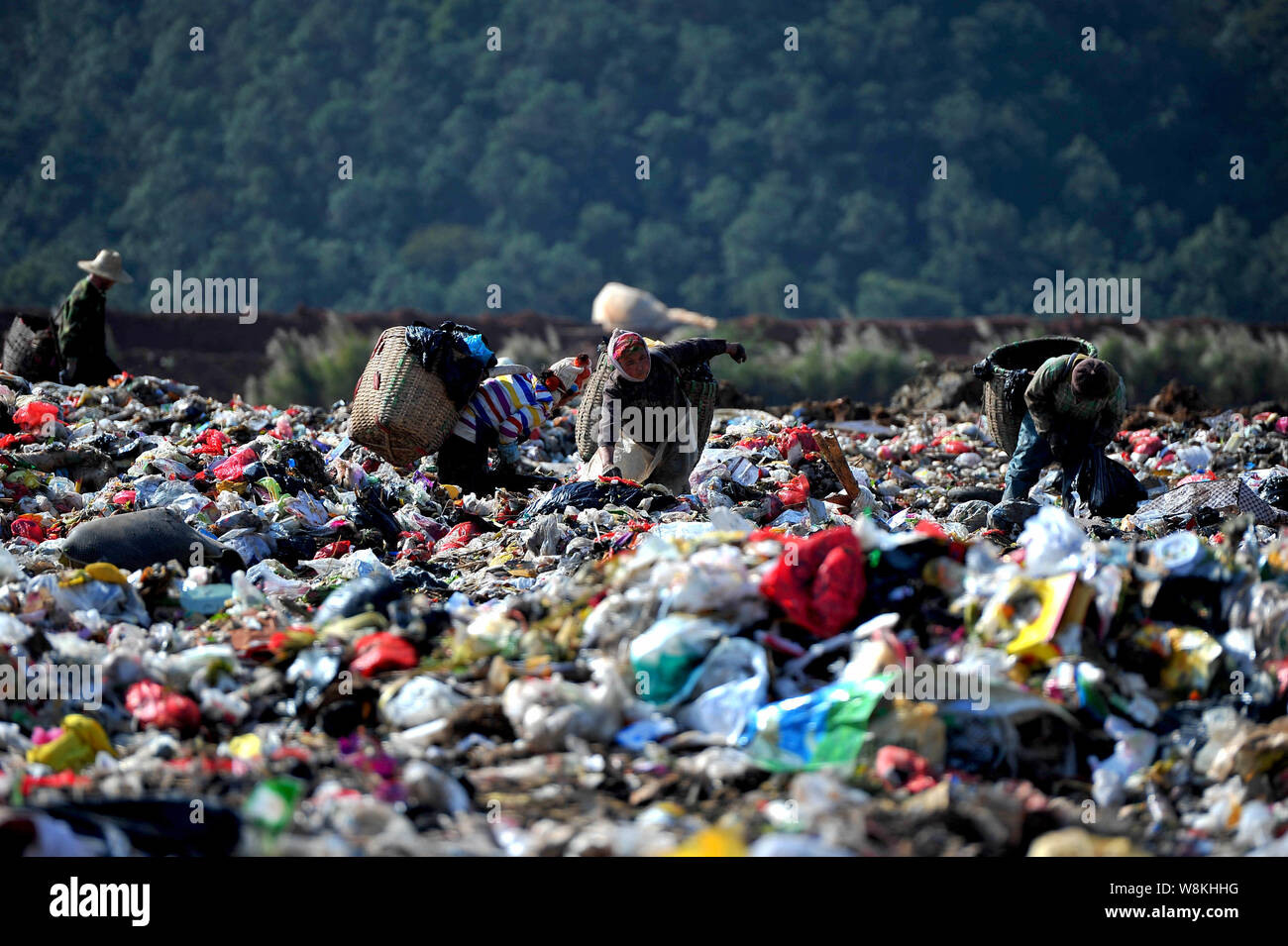 --FILE--Chinese scavengers search for useful and recyclable things in ...