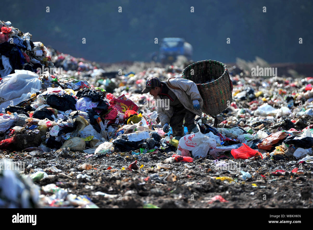 --FILE--A Chinese scavenger searches for useful and recyclable things ...