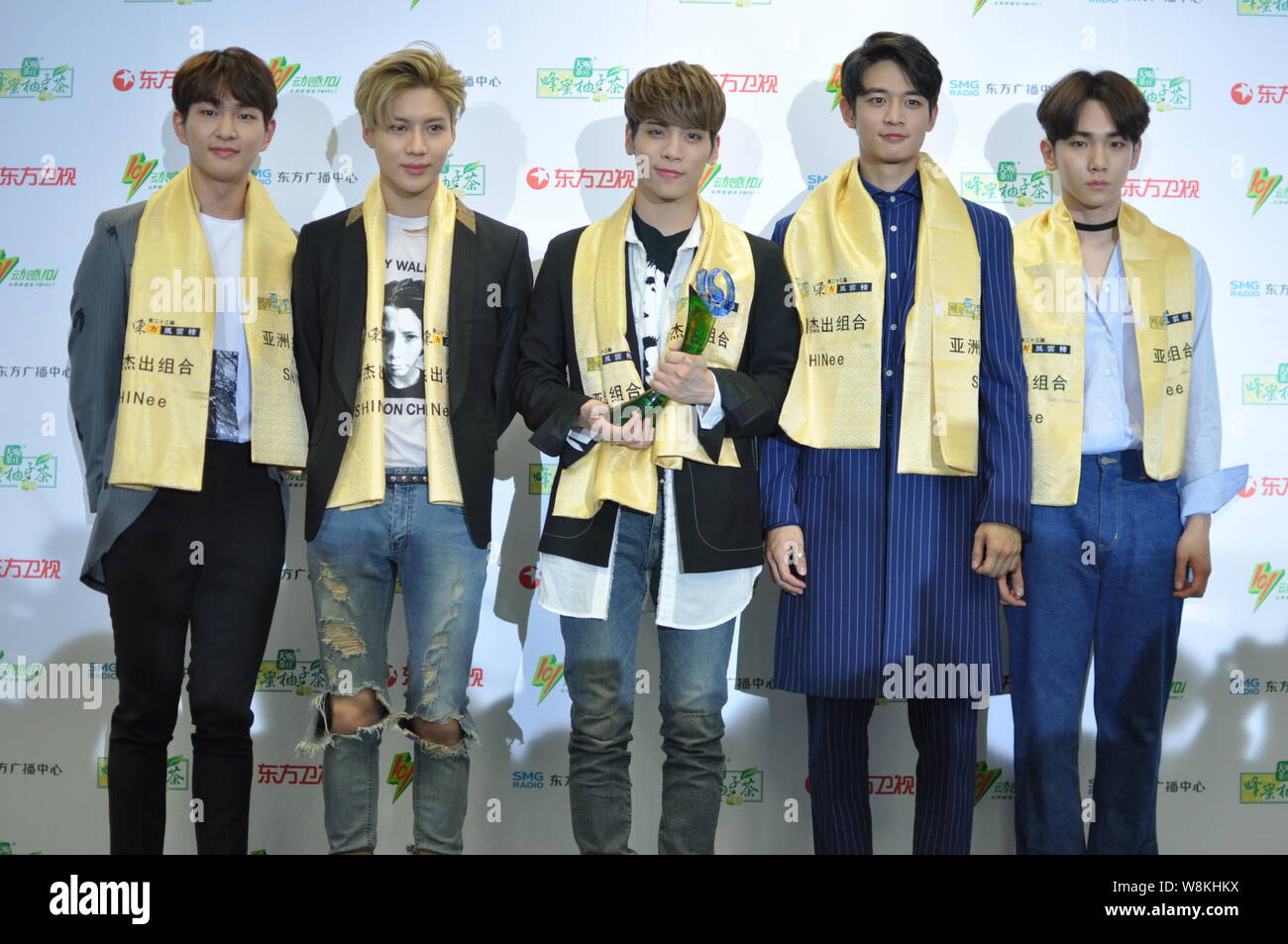 Members of South Korean boy group SHINee pose backstage during the presentation ceremony of the ...