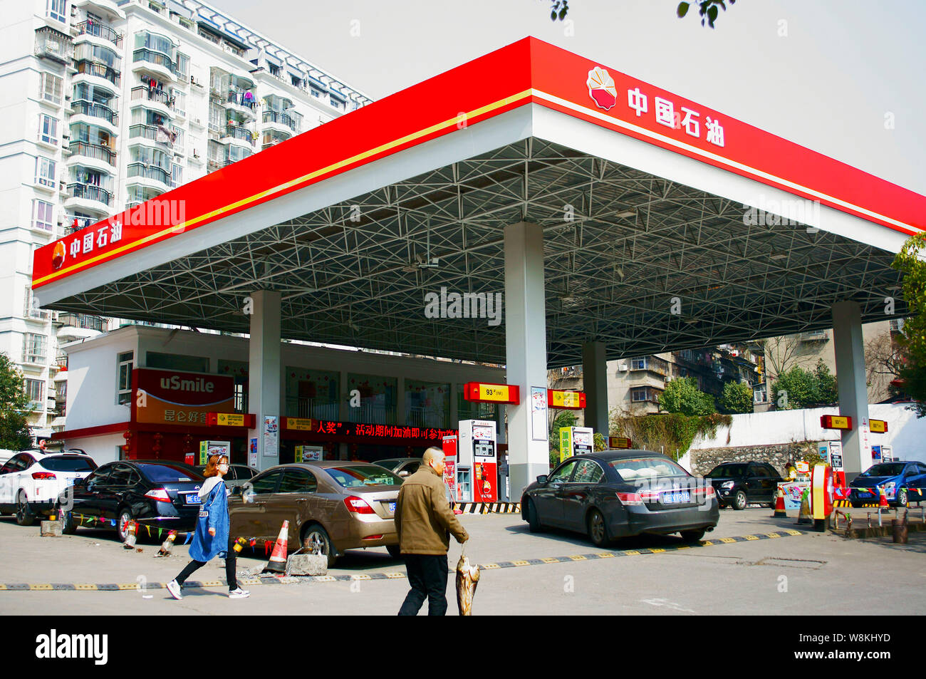 --FILE--Cars are being refueled at a gas station of PetroChina, a ...