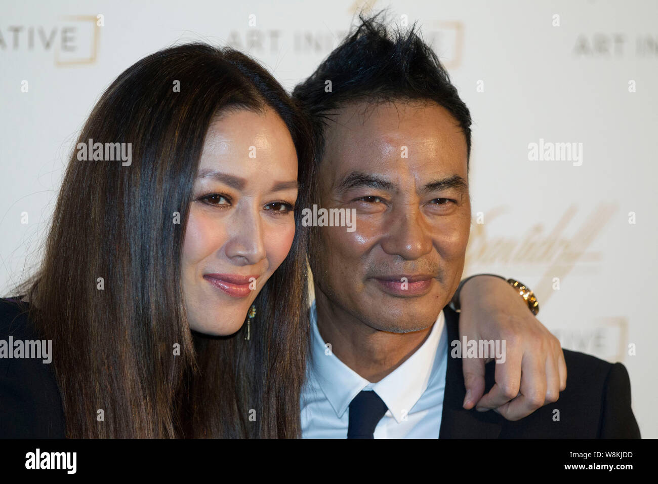 Hong Kong actor Simon Yam, right, and his model wife Sophia Kao pose at ...