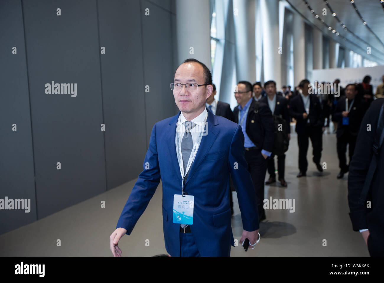 Guo Guangchang, front, Chairman of Fosun Group, arrives for the opening ...