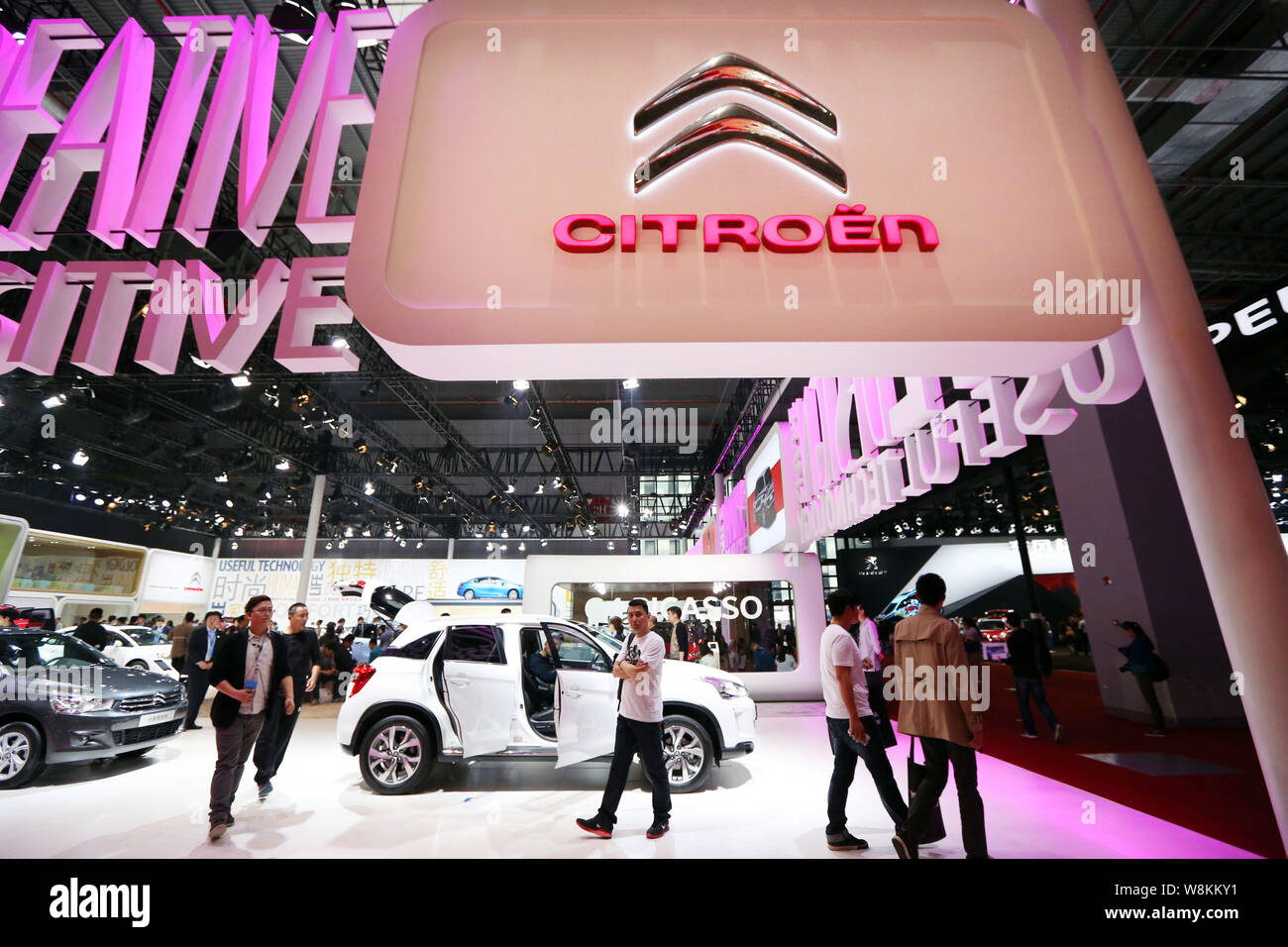 --FILE--Visitors look at Citroen cars of PSA on display during the 16th ...
