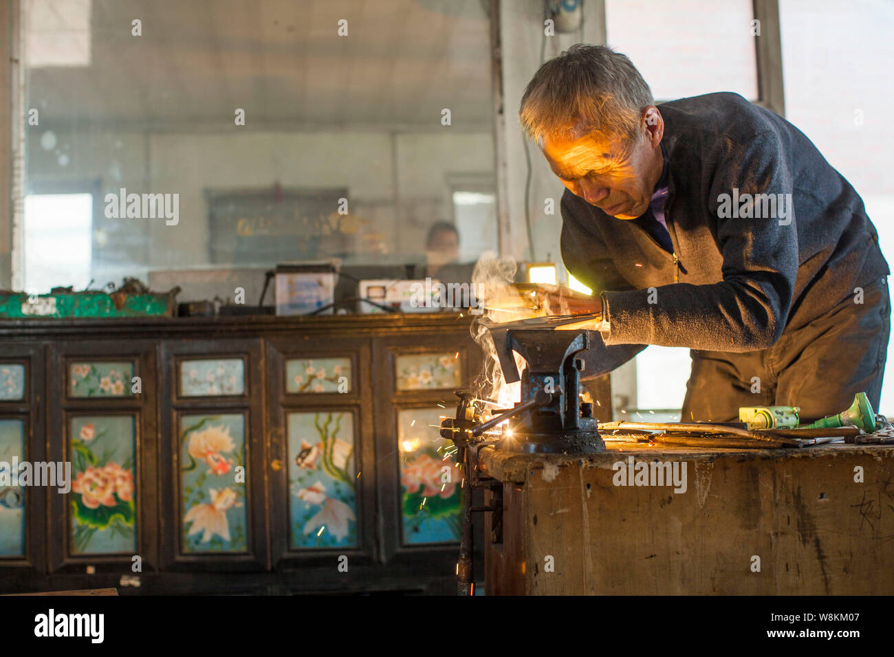 63-year-old armless farmer Sun Jifa who is equipped with his homemade ...