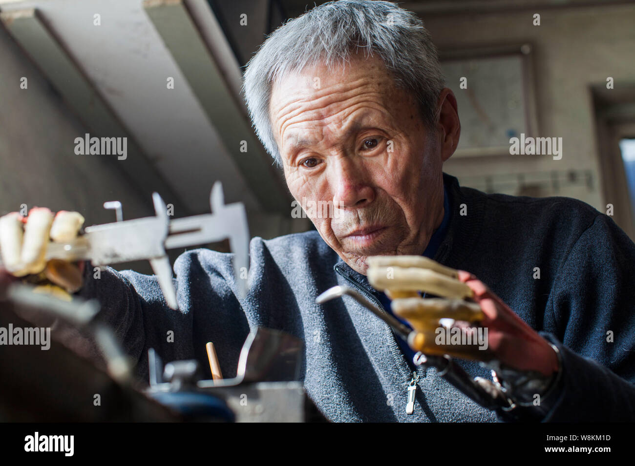 63-year-old armless farmer Sun Jifa who is equipped with his homemade ...