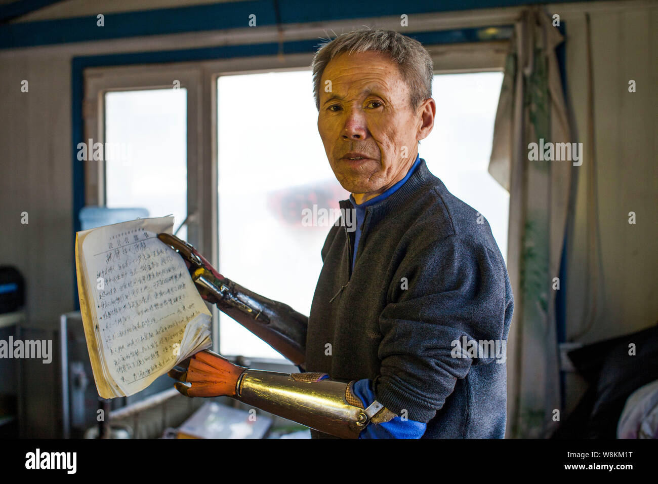 63-year-old armless farmer Sun Jifa who is equipped with his homemade ...