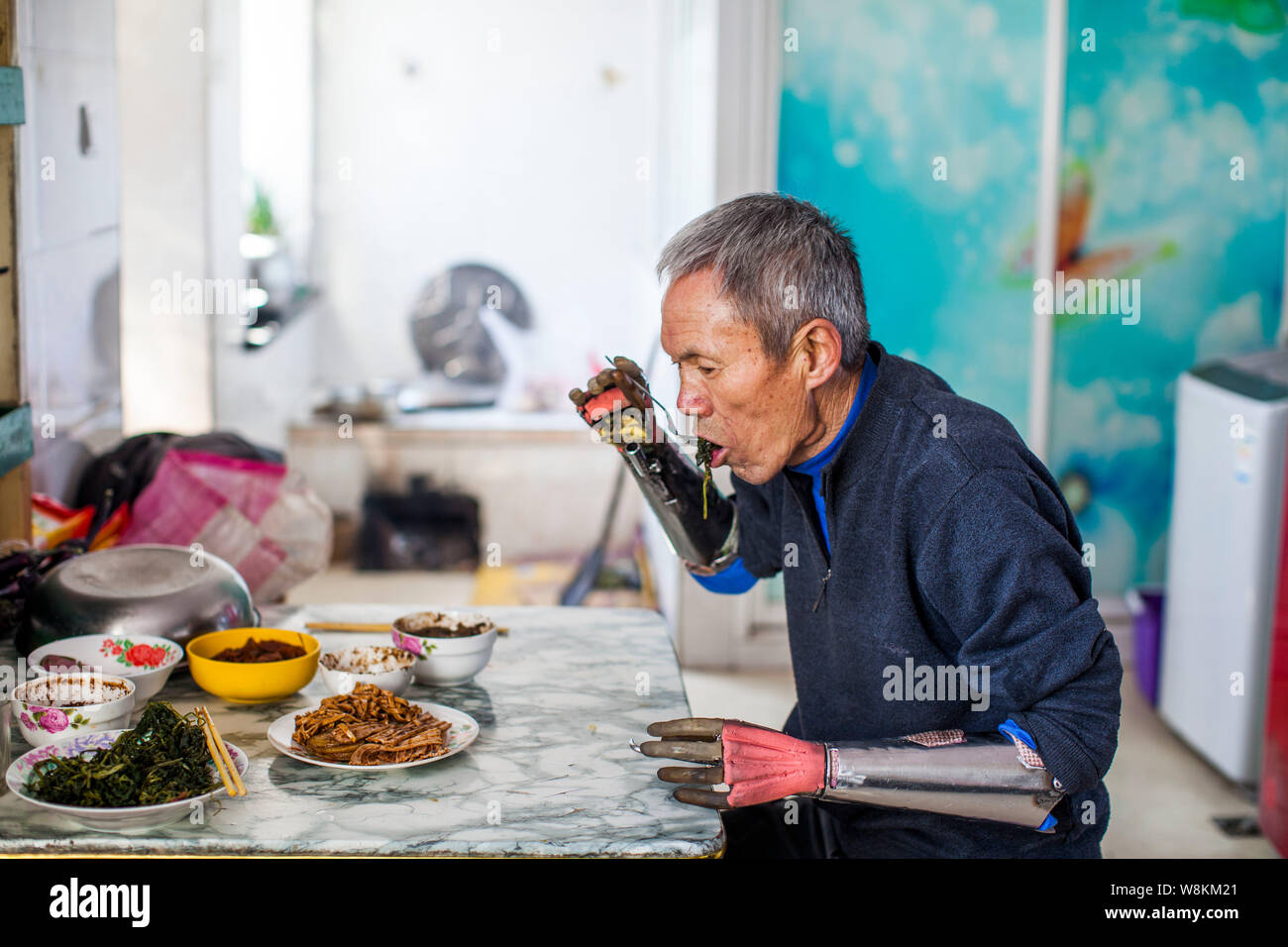 63-year-old armless farmer Sun Jifa who is equipped with his homemade ...