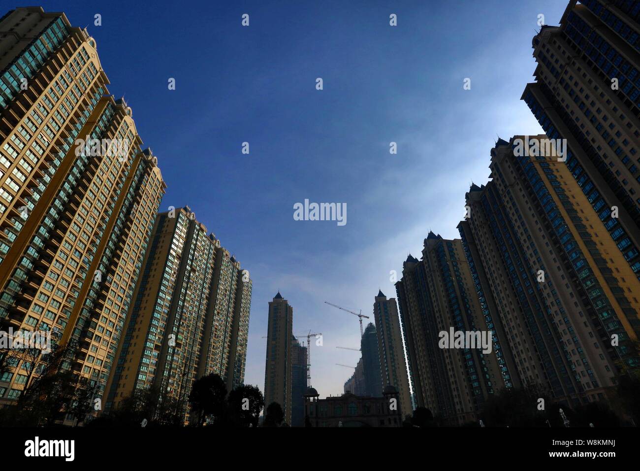 --FILE--Newly-built high-rise residential apartment buildings are ...
