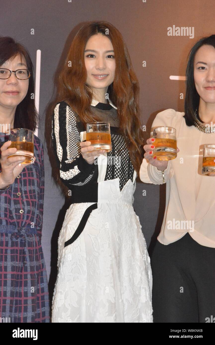 Hebe Tien Fu-chen, center, of Taiwanese pop group S.H.E attends a press ...