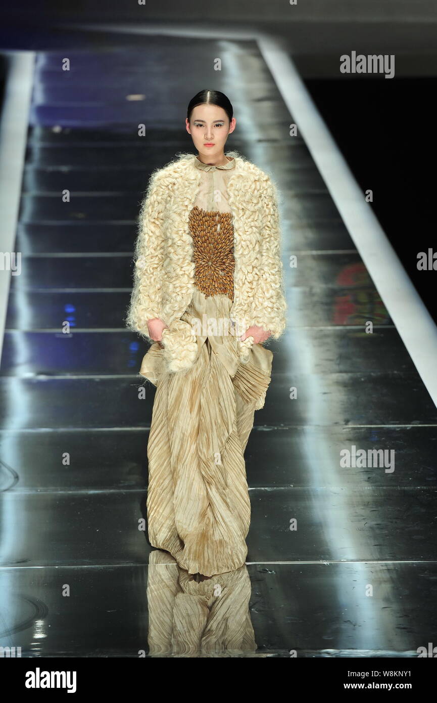 A model displays a new creation at Hempel Award - The 24th China ...