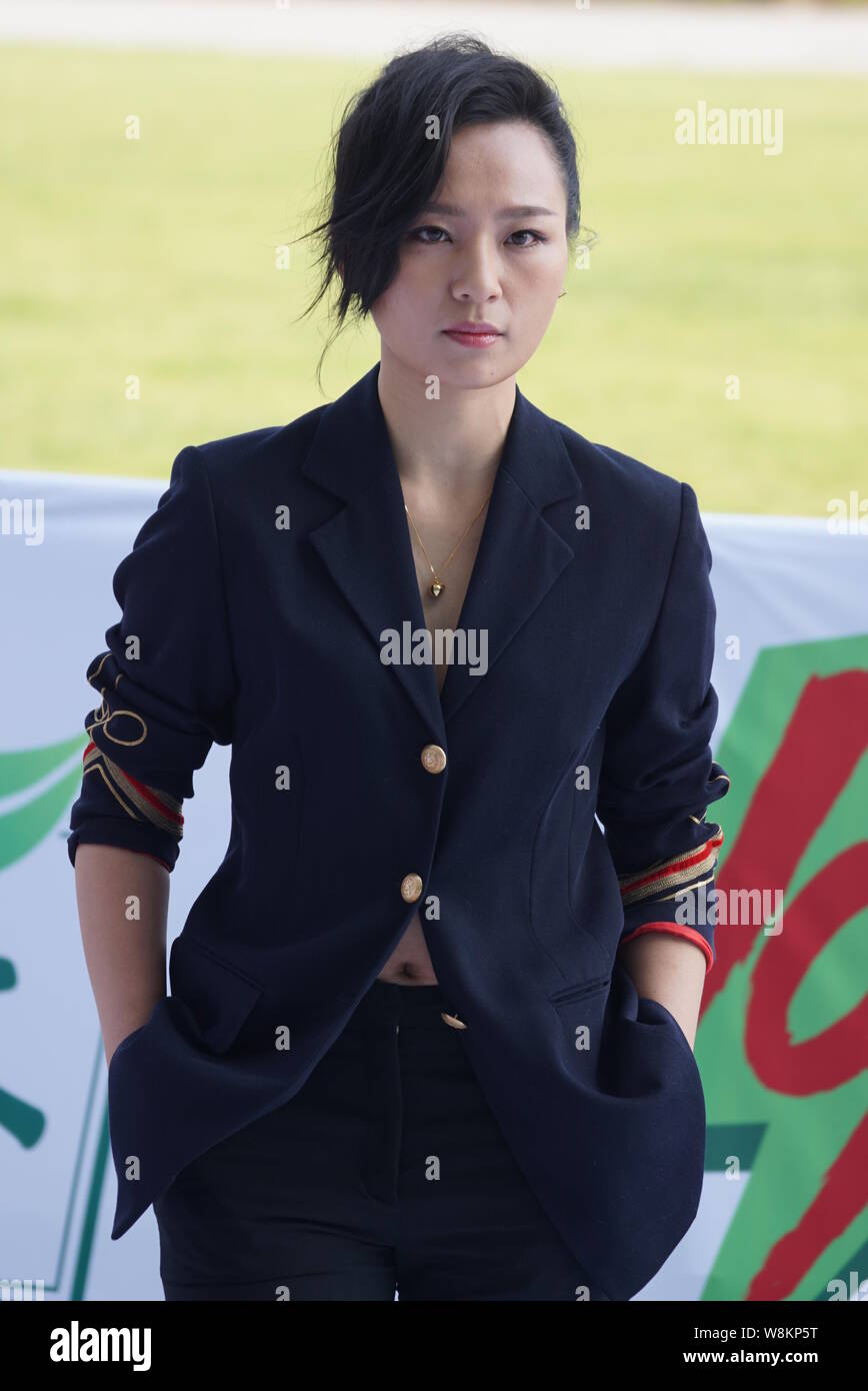 Chinese singer Zhou Bichang arrives for the presentation ceremony of ...