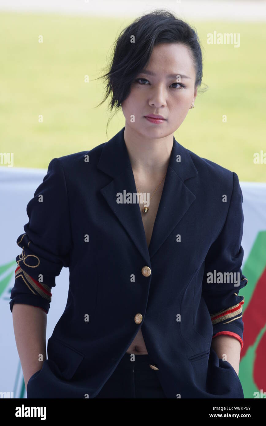 Chinese singer Zhou Bichang arrives for the presentation ceremony of ...