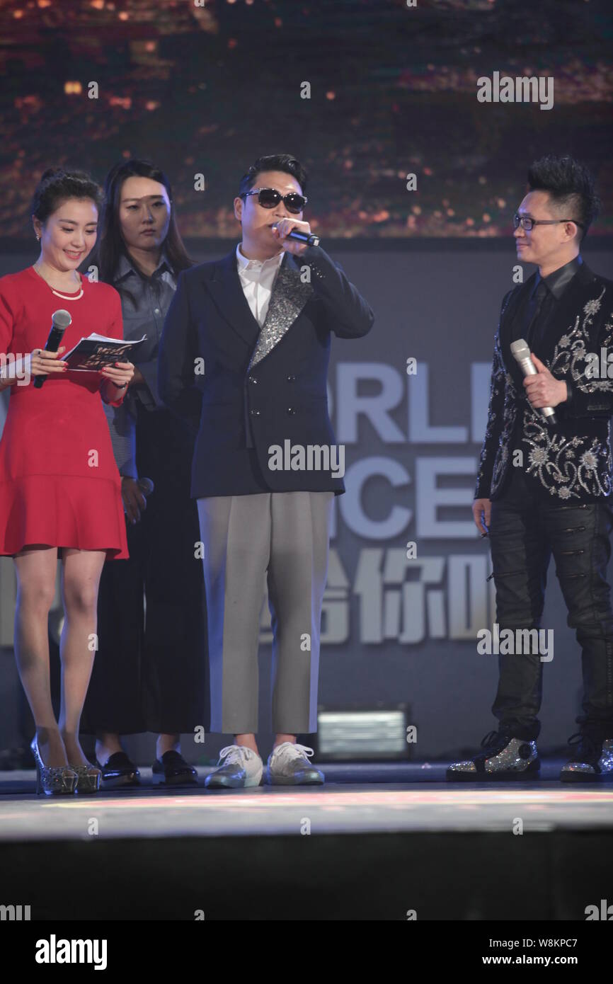 South Korean singer-songwriter Park Jae-sang, center, better known by ...