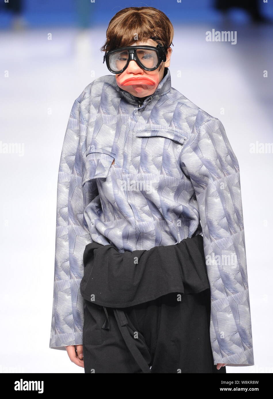 A model displays a new creation from the Beijing Institute of Fashion ...