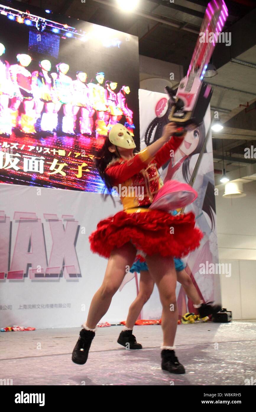 Members of Japanese idol girl group Kamen Joshi, literally "Masked Girls", perform during the ...