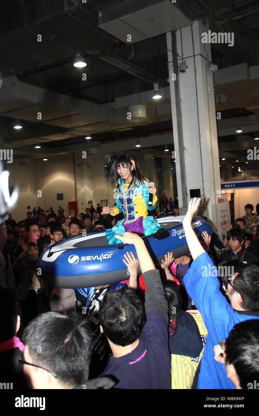 A member of Japanese idol girl group Kamen Joshi, literally "Masked Girls", performs during the ...