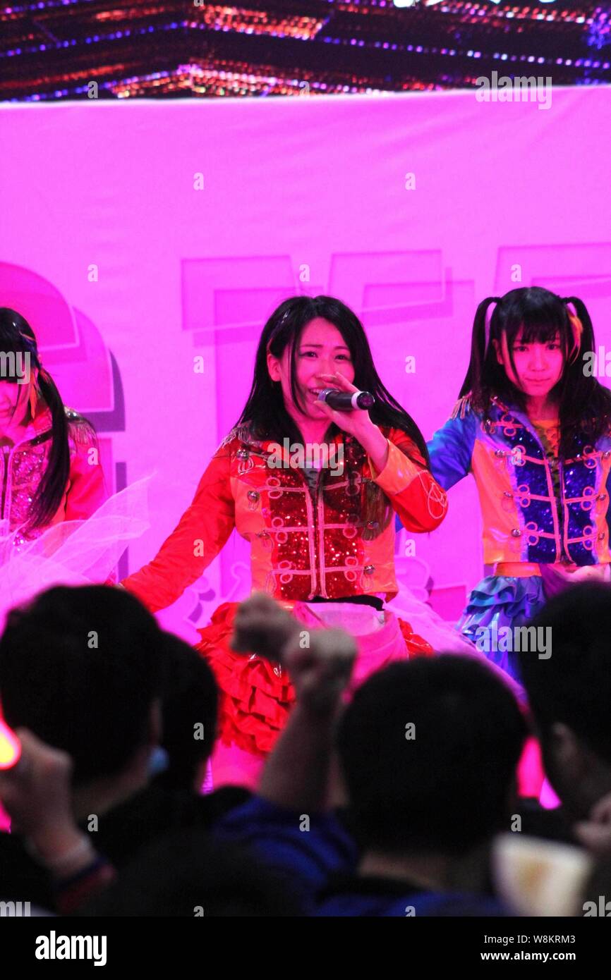 Members of Japanese idol girl group Kamen Joshi, literally "Masked Girls", perform during the ...
