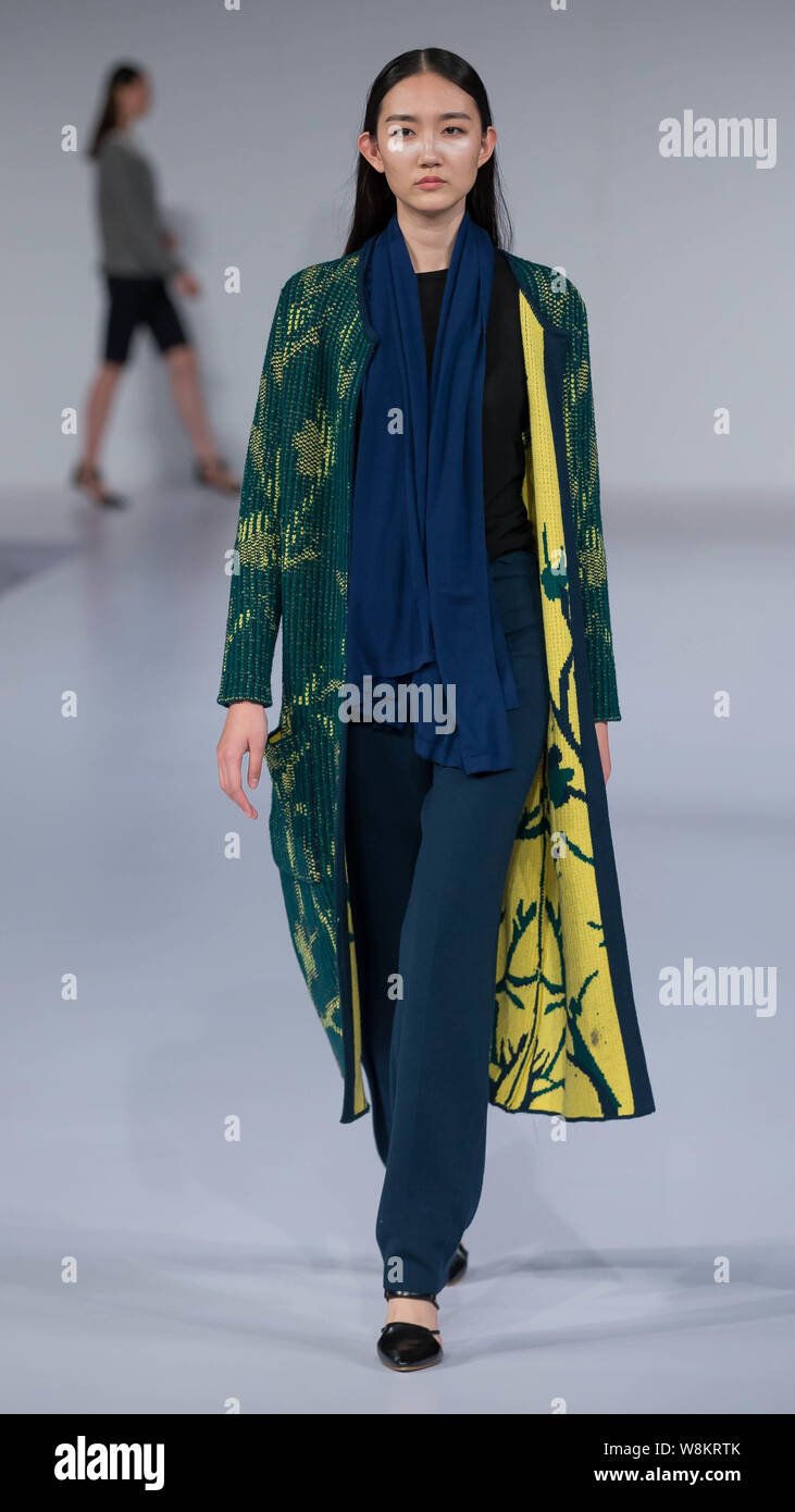 A model displays a new creation by Chinese designer Guo Ruiping at the ...