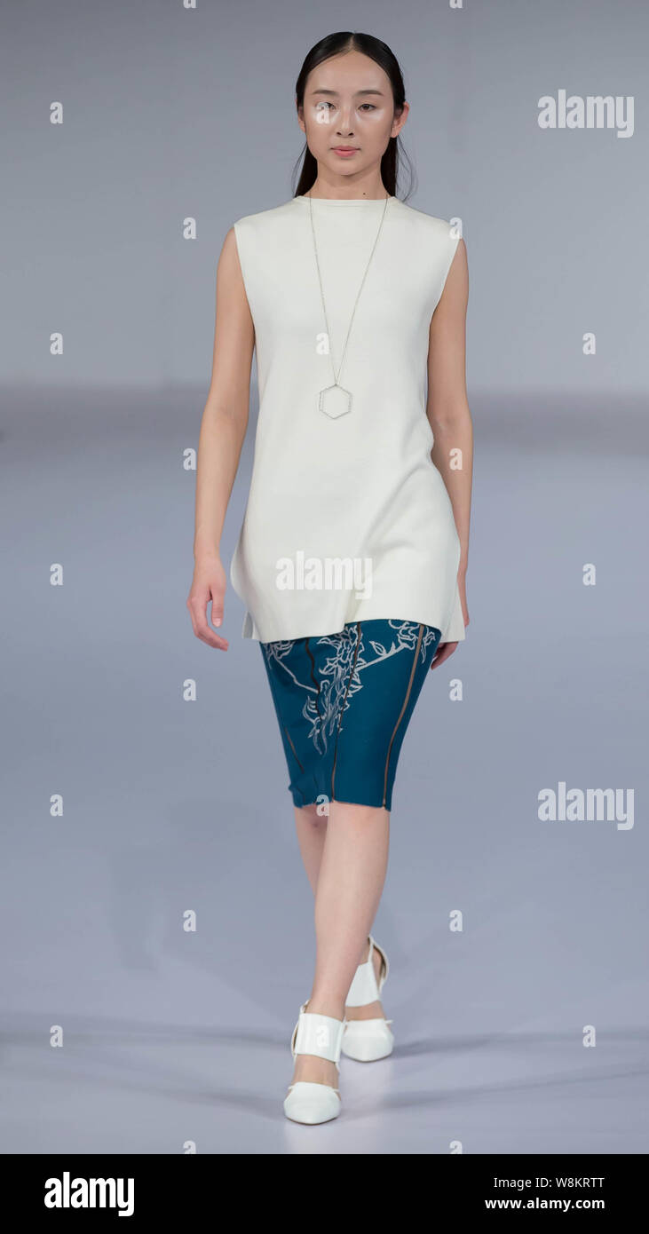 A model displays a new creation by Chinese designer Guo Ruiping at the ...