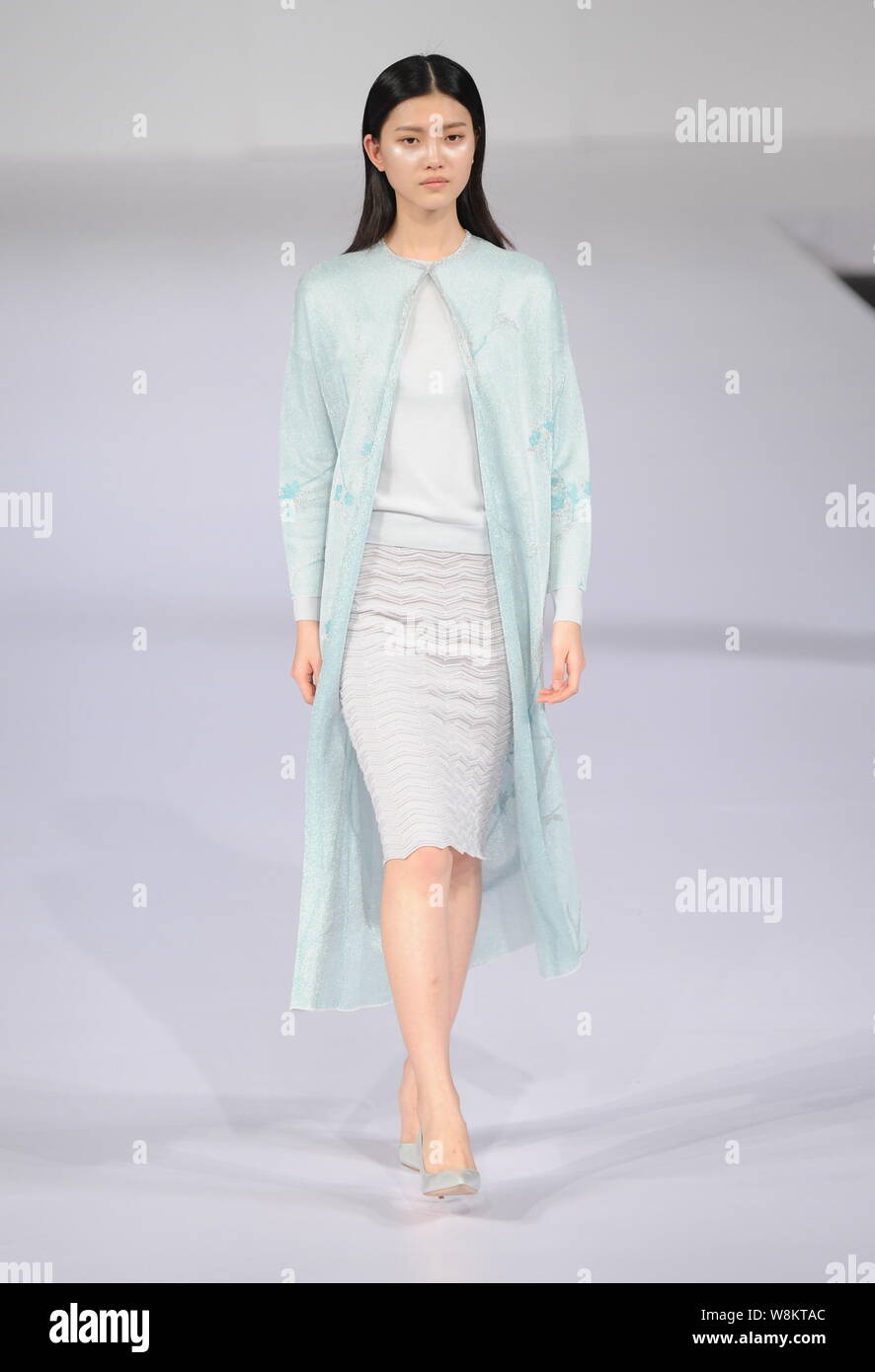 A model displays a new creation by Chinese designer Guo Ruiping at the ...