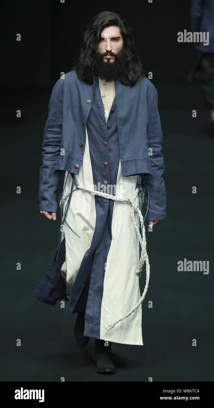 A model displays a new creation at the fashion show of Xinshen Linen ...