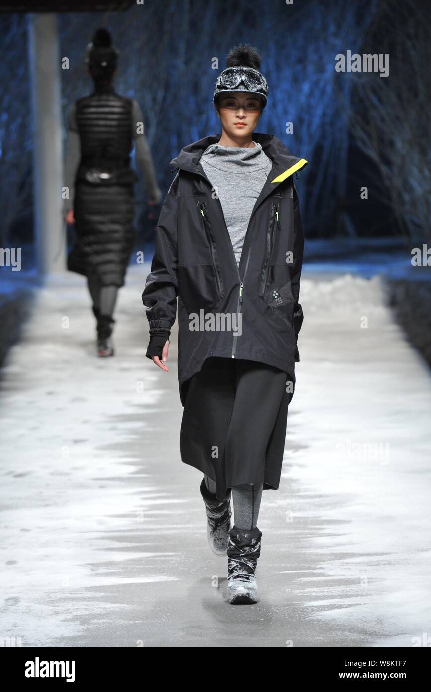 A model displays a new creation at the fashion show of Bosideng China ...