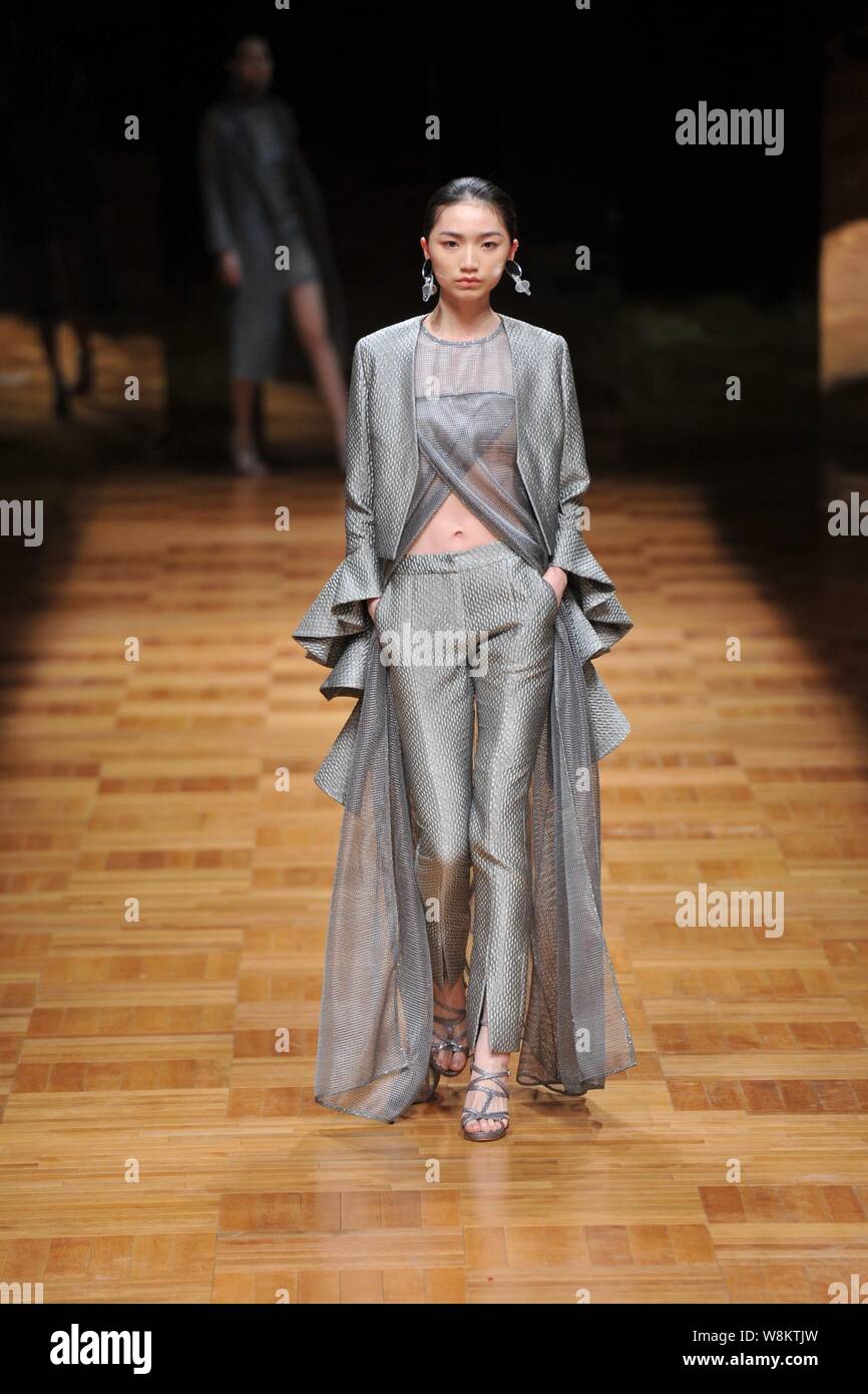 A model displays a new creation at the Asahi Kasei Chinese Fashion ...