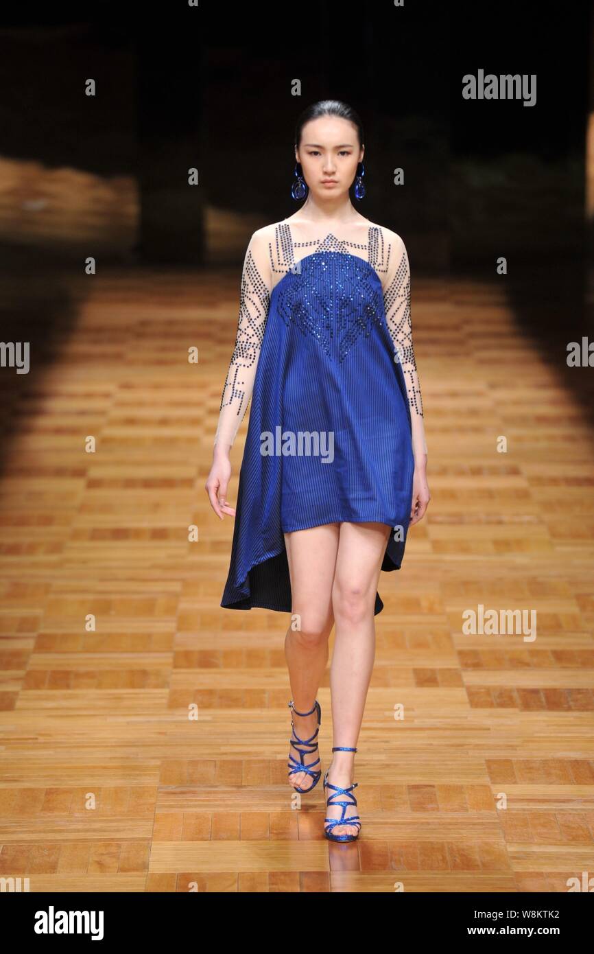 A model displays a new creation at the Asahi Kasei Chinese Fashion ...