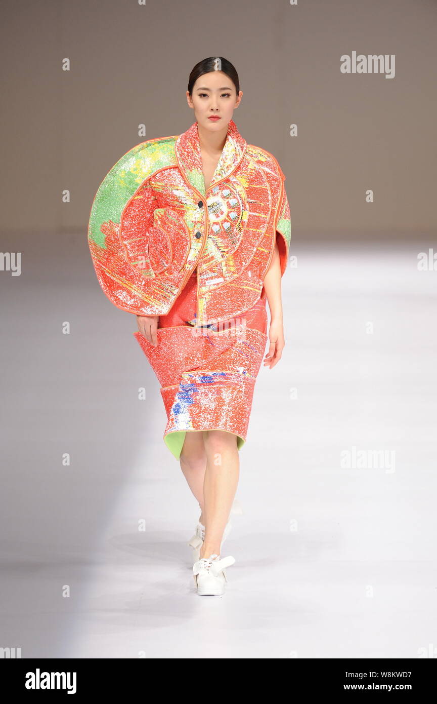 A model displays a new creation from the Beijing Institute of Fashion ...