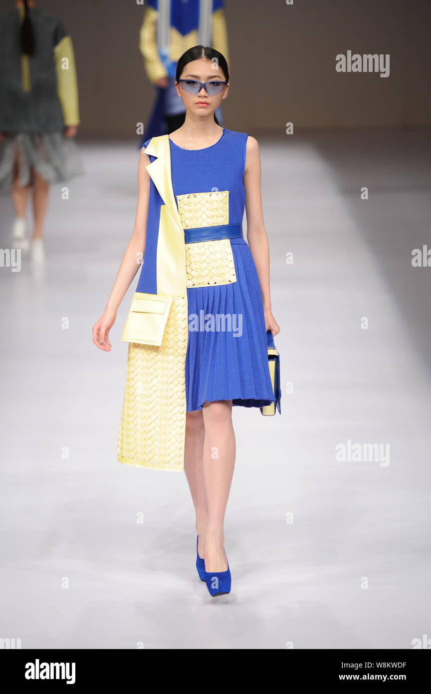 A model displays a new creation from the Beijing Institute of Fashion ...