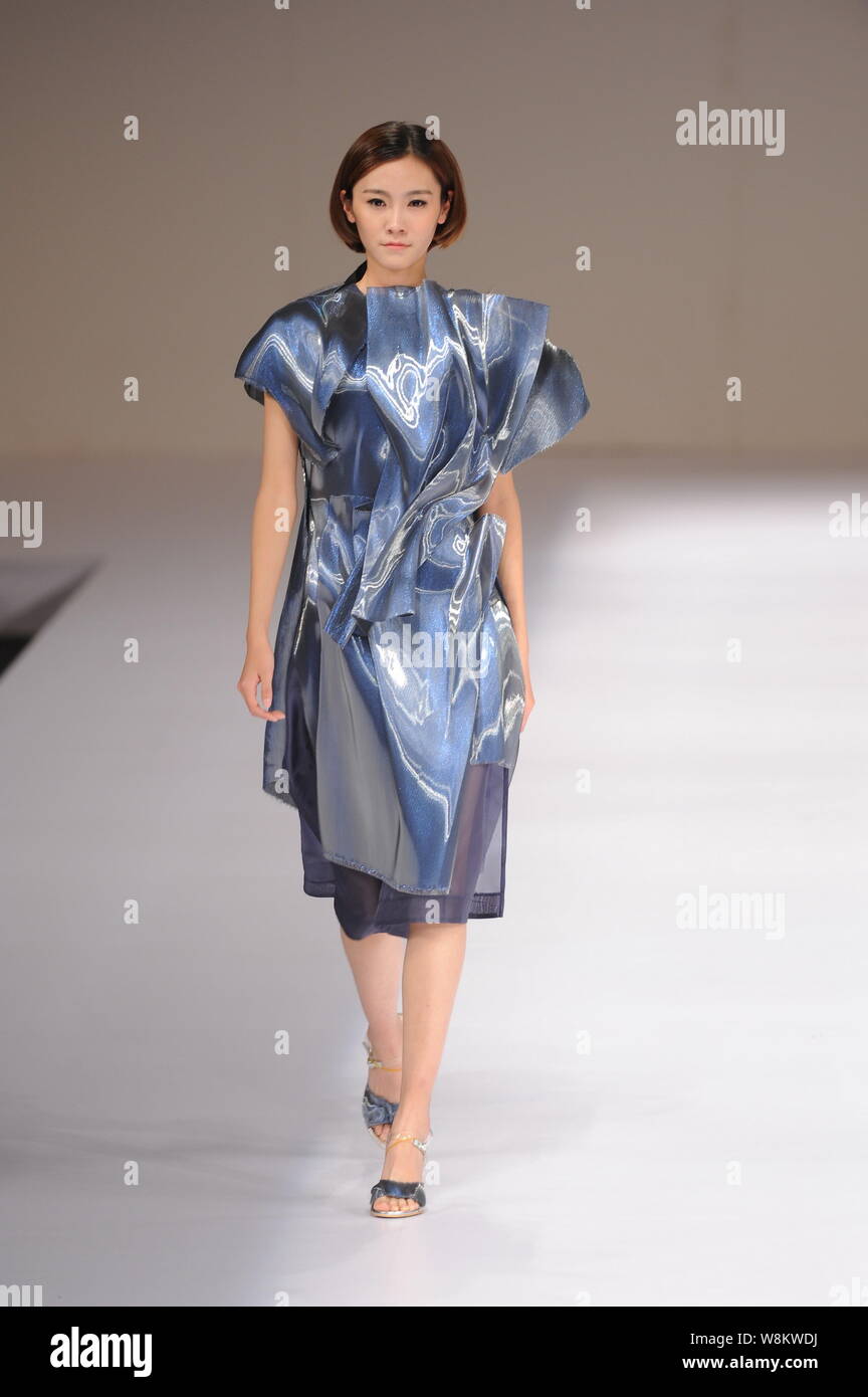 A model displays a new creation from the Beijing Institute of Fashion ...