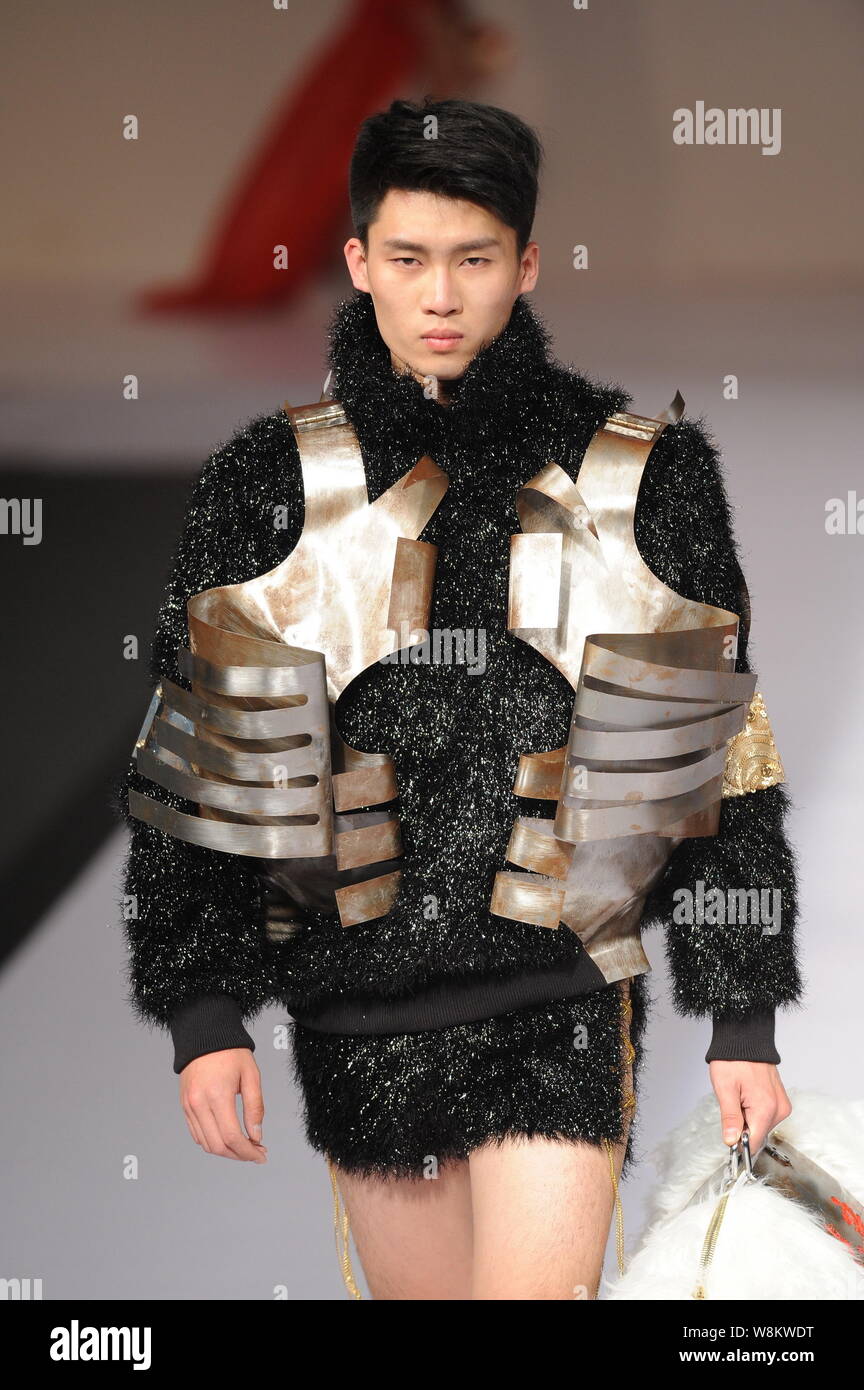 A model displays a new creation from the Beijing Institute of Fashion ...